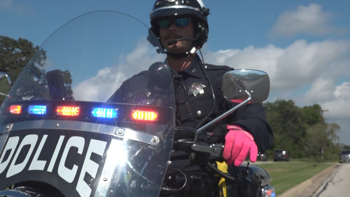 CSPD officer donning pink gloves to support breast cancer awareness ...